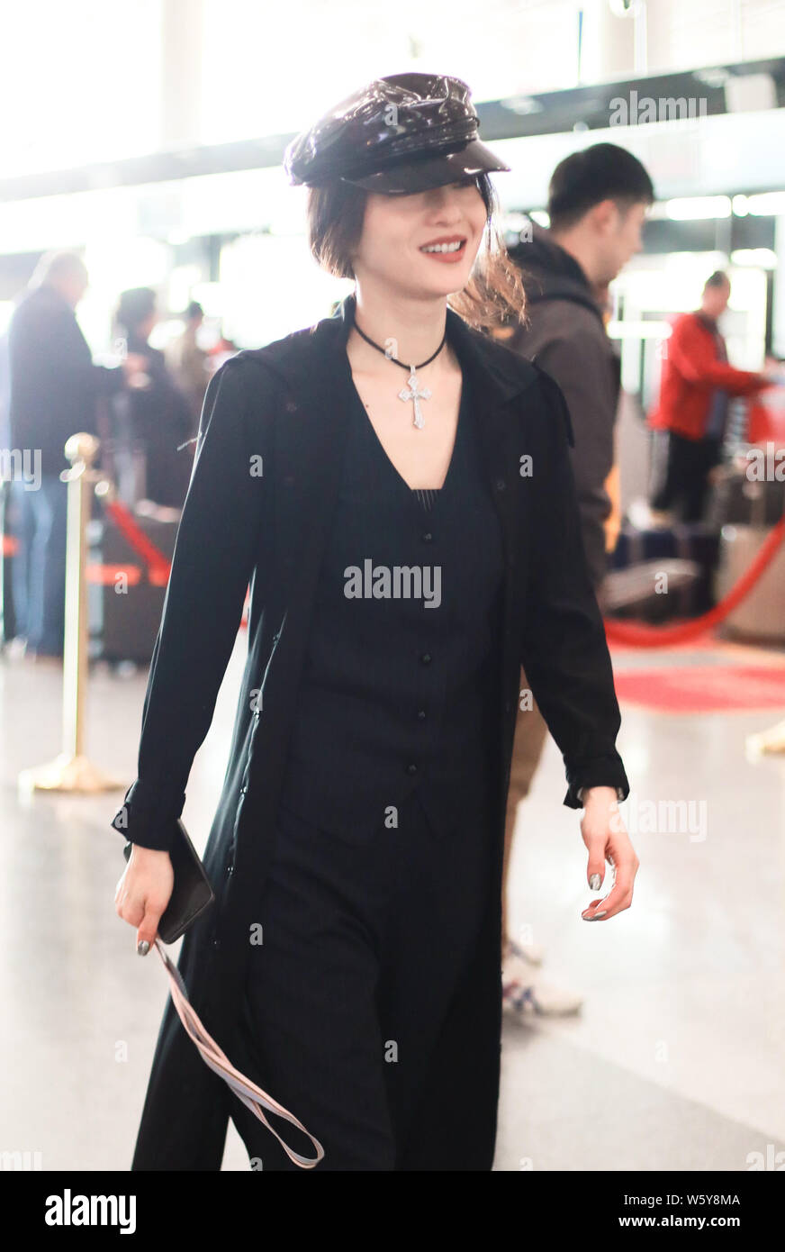 Taiwanese singer and actress Angela Chang arrives at an airport before ...