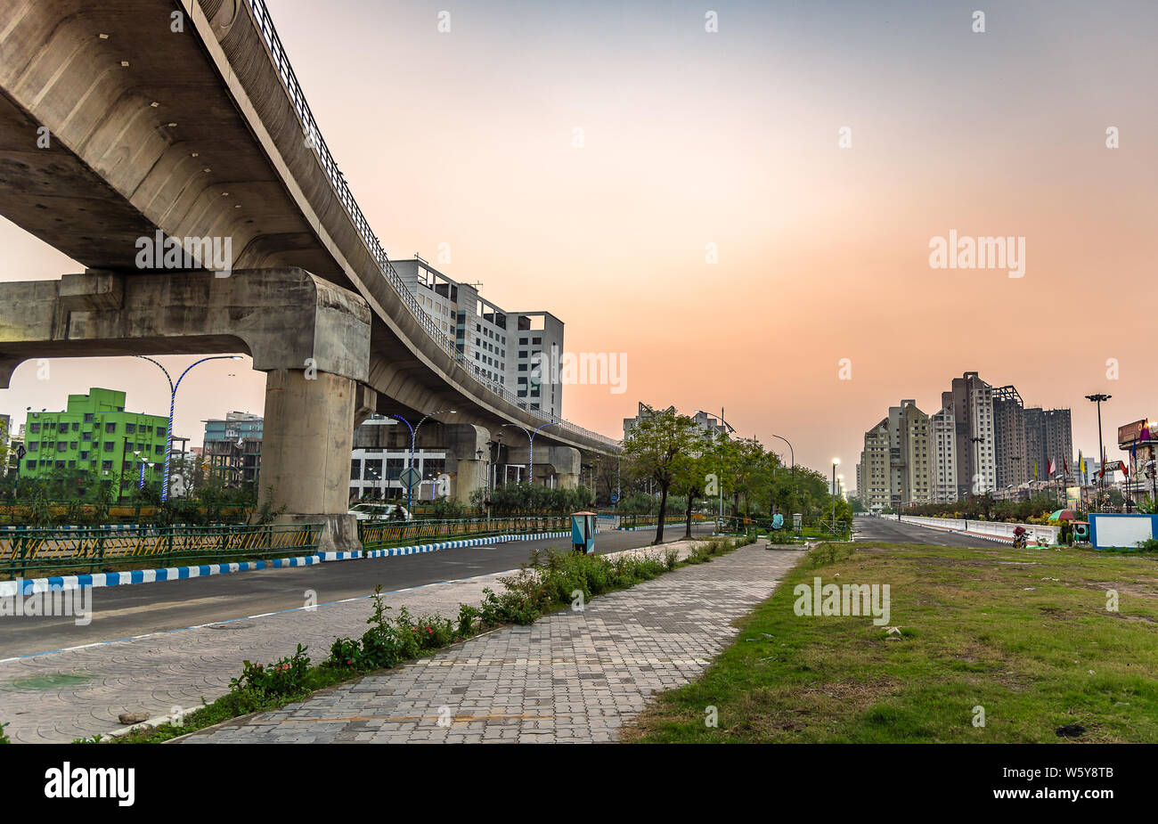 Tall colorful city buildings with under construction Flyover at ...