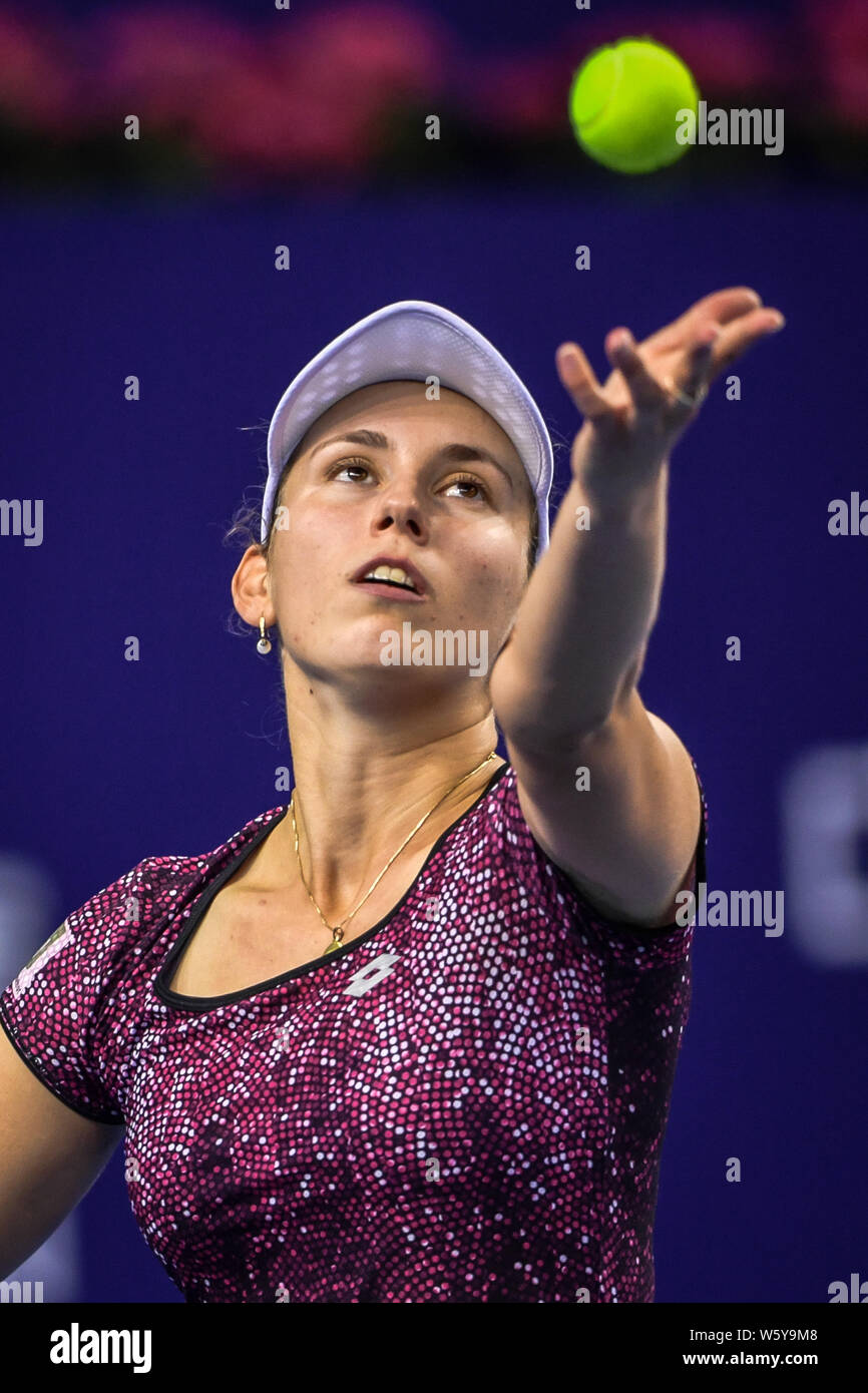 Elise Mertens of Belgium serves against Julia Gorges of Germany in ...