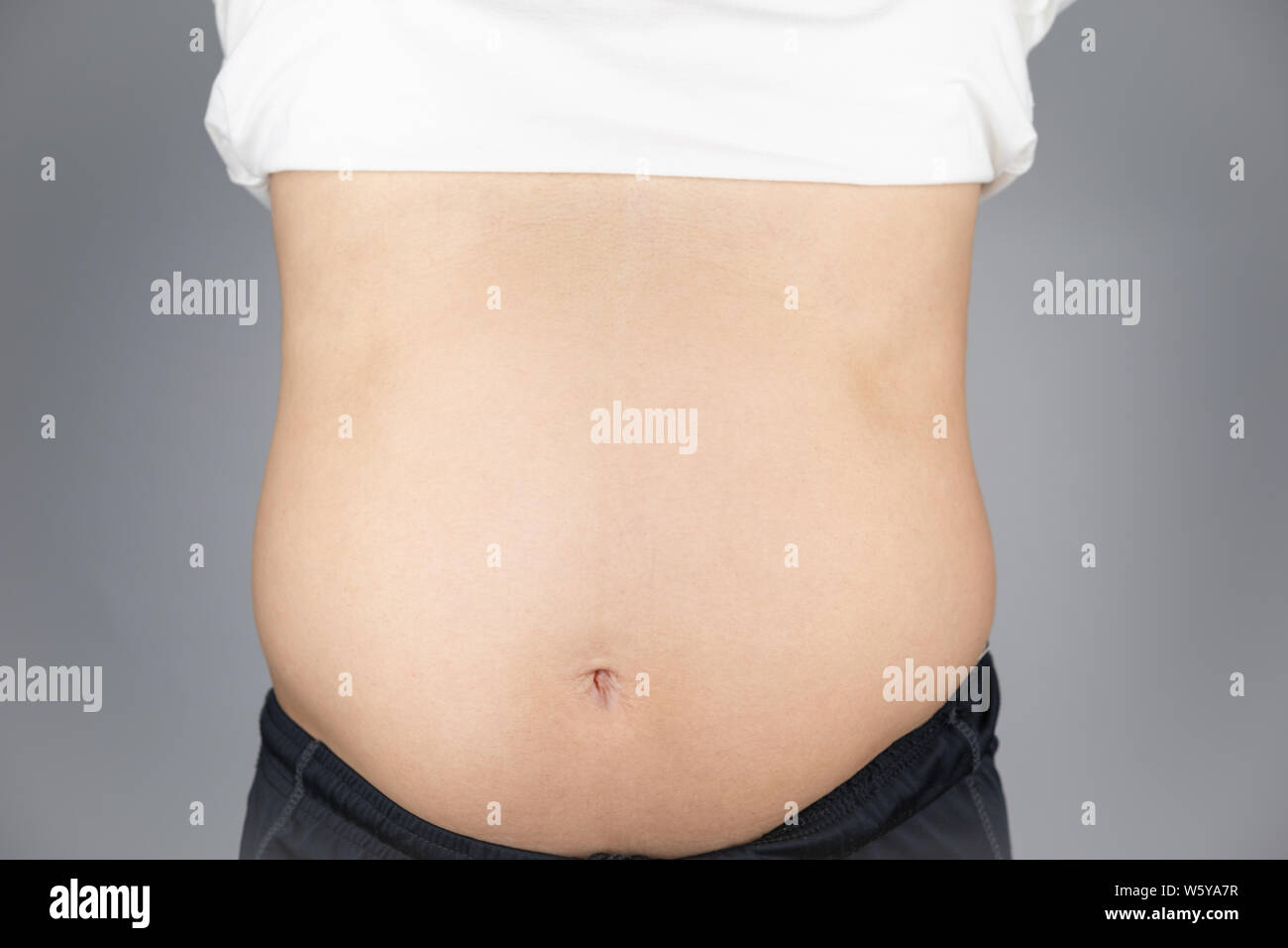 Close up of male navel hi-res stock photography and images - Alamy