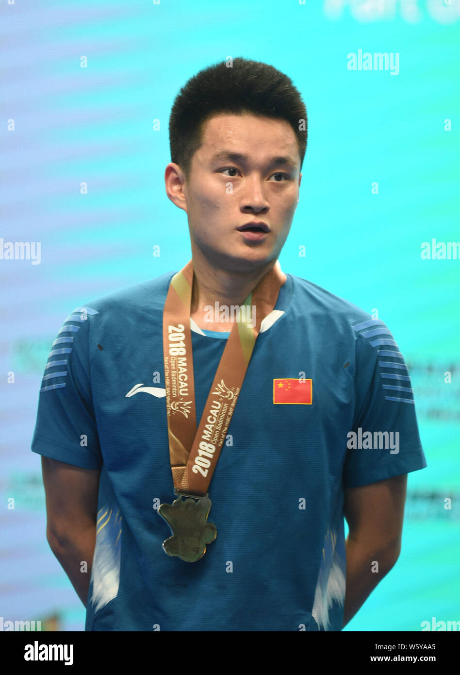 Zhou Zeqi of China attends the award ceremony after the final match of ...