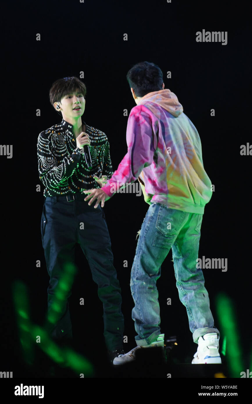 Roy Wang Yuan, left, of Chinese boy group TFBoys and his idol ...