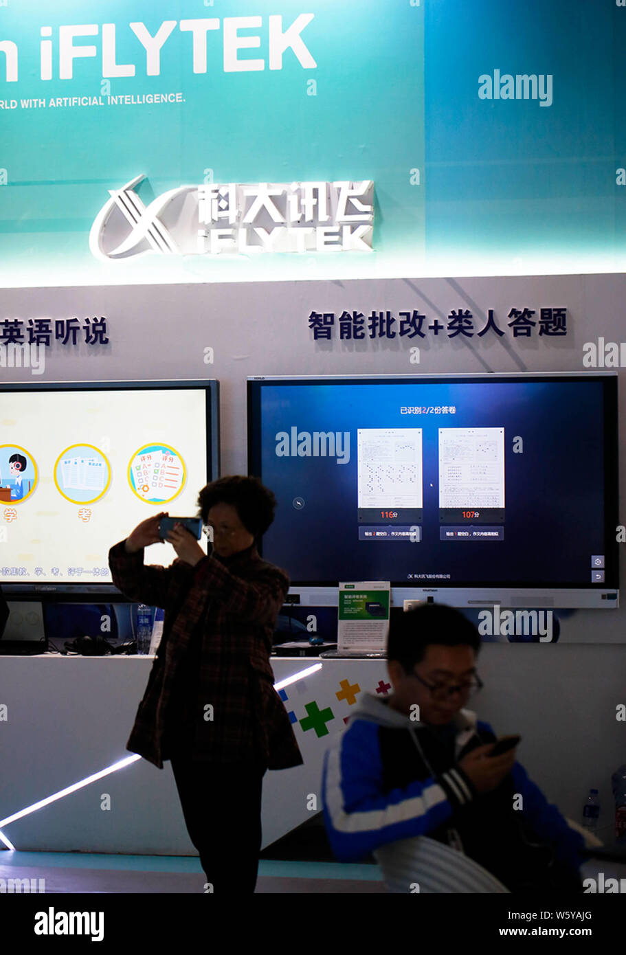 --FILE--People visit the stand of iFlytek, China's largest voice recognition company during an ...