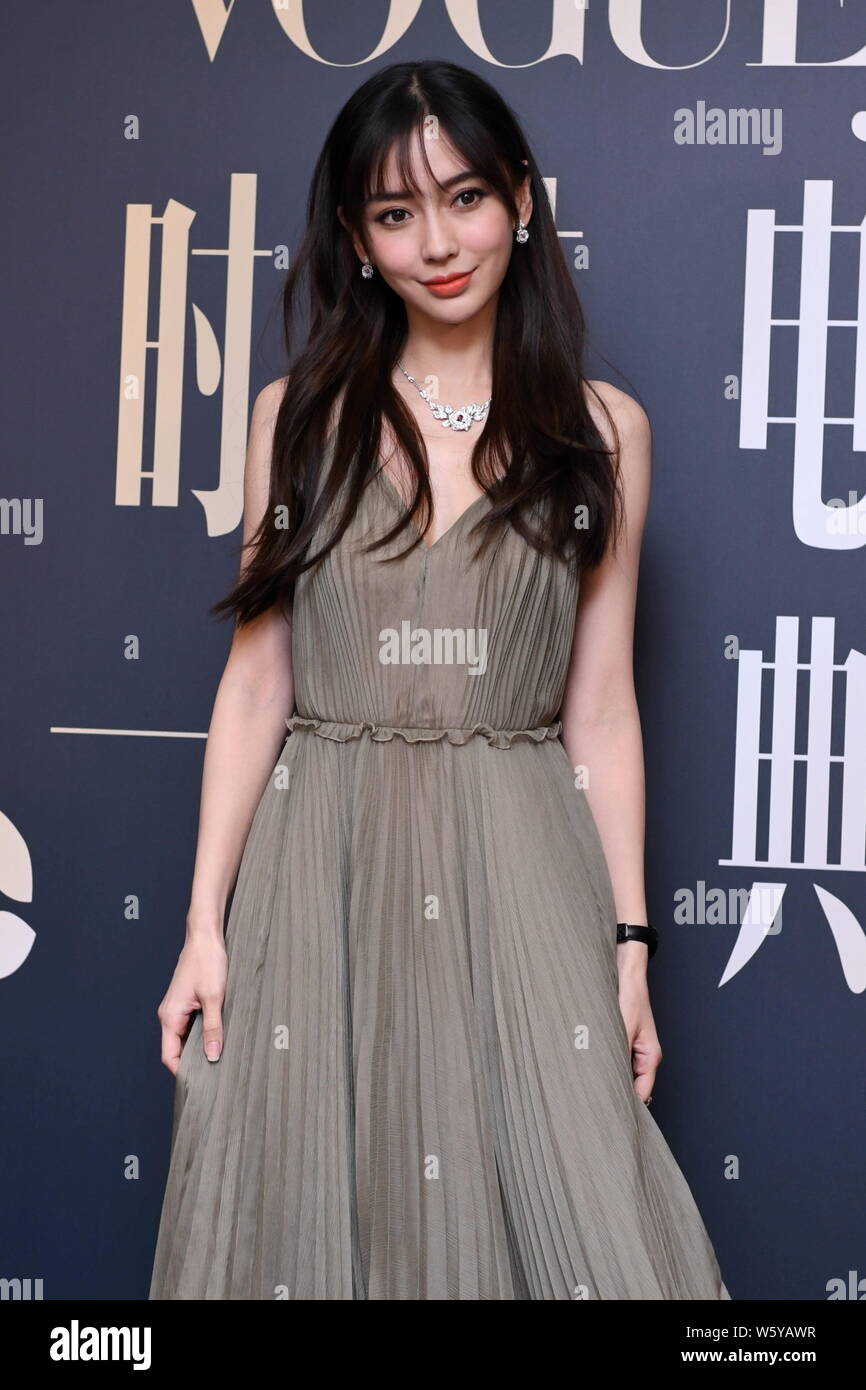 Hong Kong actress Angelababy poses as she arrives on the red carpet for 2018 Vogue Film ceremony ...