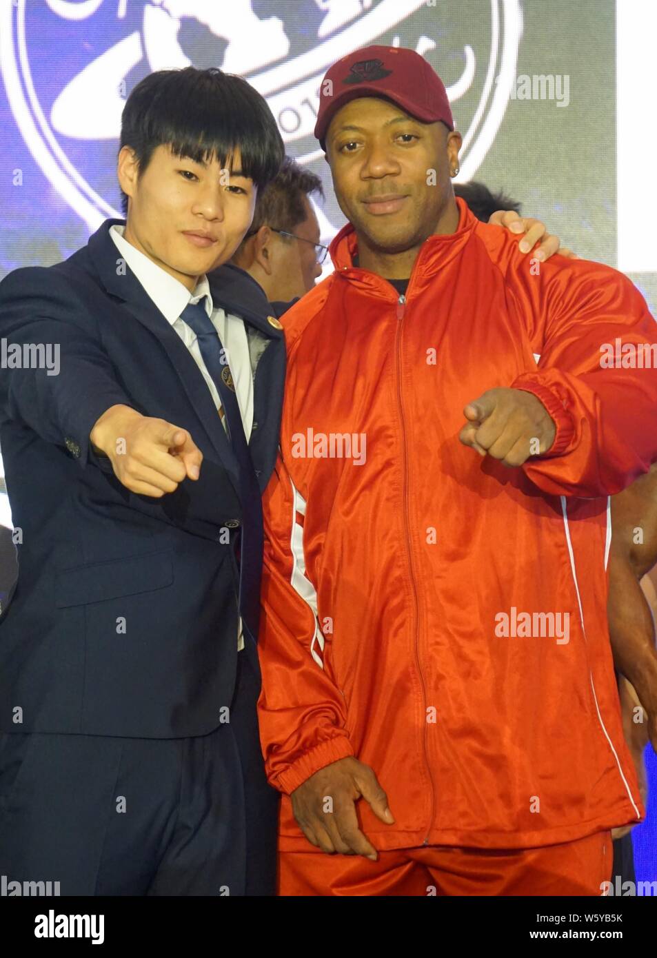 Jamaican-American IFBB professional bodybuilder Shawn Rhoden, right ...