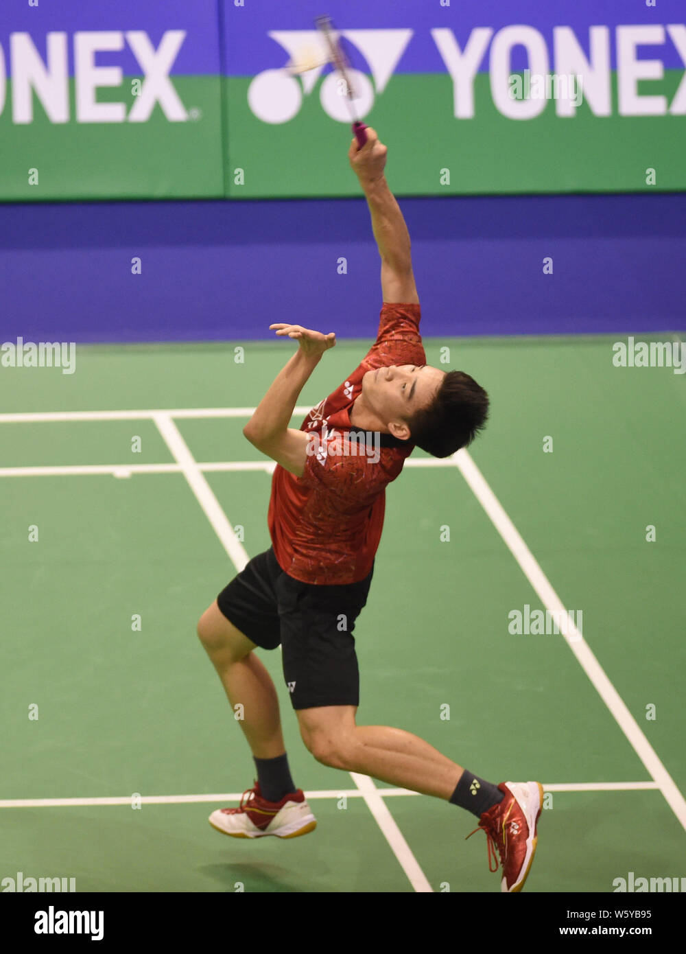 Kantaphon Wangcharoen of Thailand returns a shot to Angus Ng Ka Long of ...