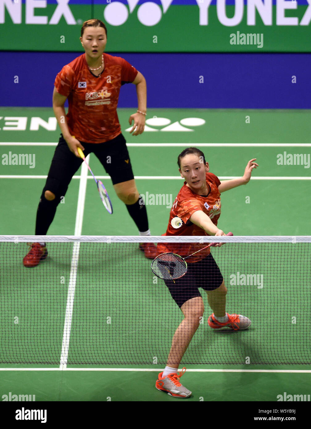 Lee So-hee and Shin Seung-chan of South Korea return a shot to Yuki ...