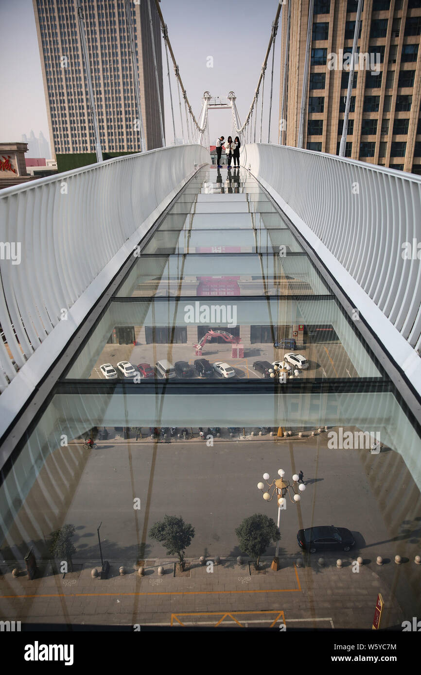 Pedestrians walk on China's first urban glass bridge in Shijiazhuang ...