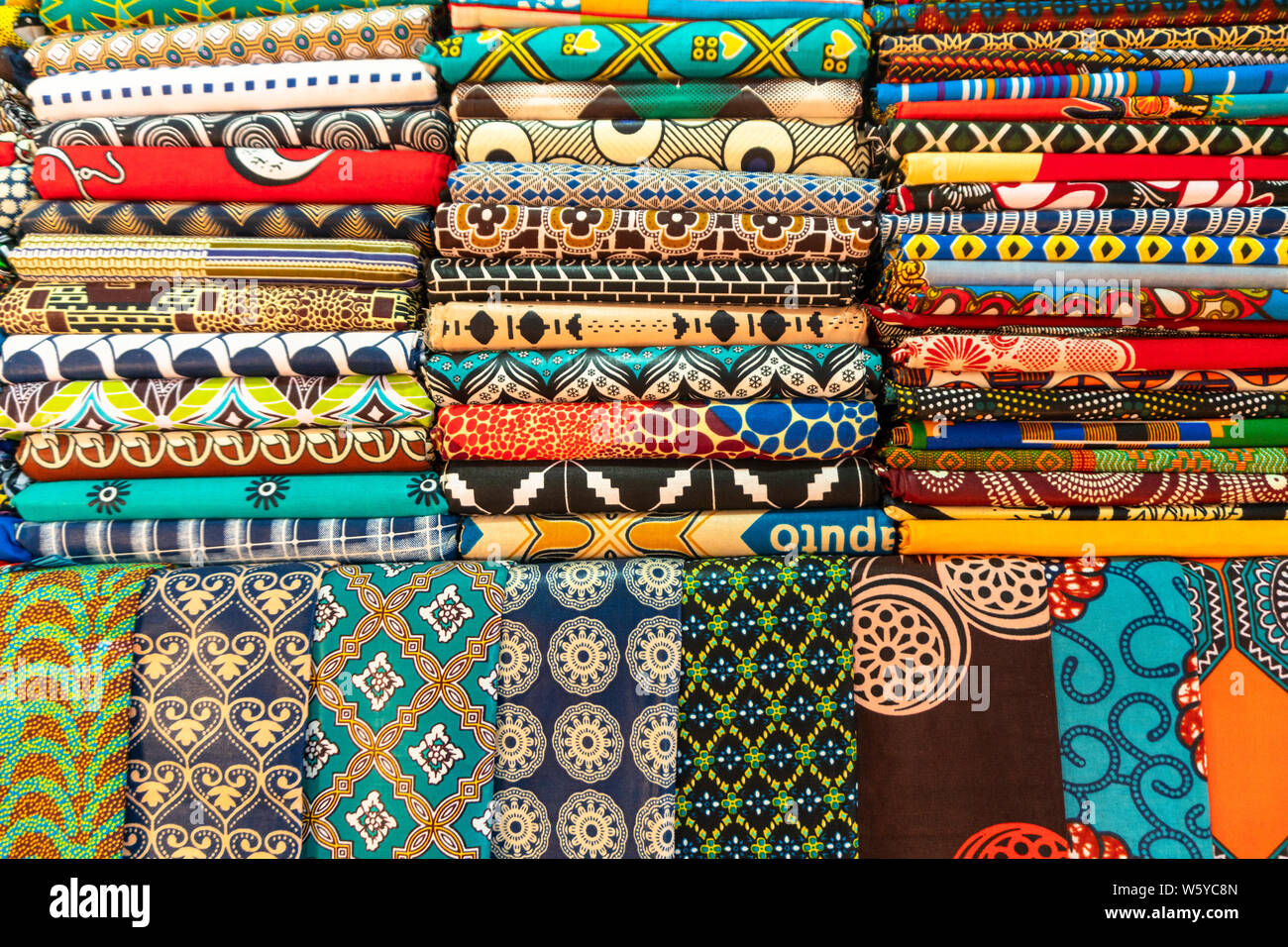 Plenty of colorful african fabrics on local open air market, Maputo ...