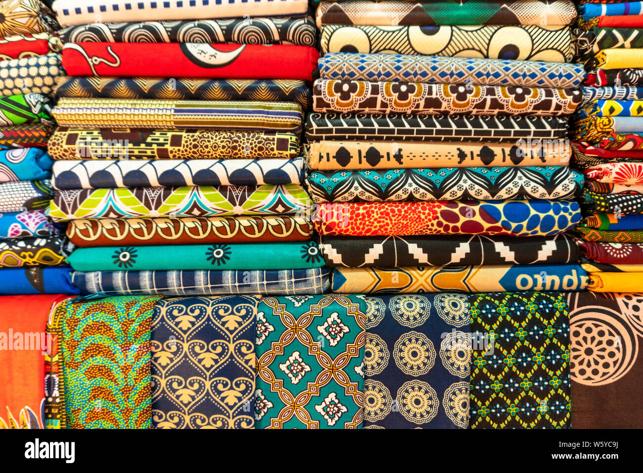 Plenty of colorful african fabrics on local open air market, Maputo ...