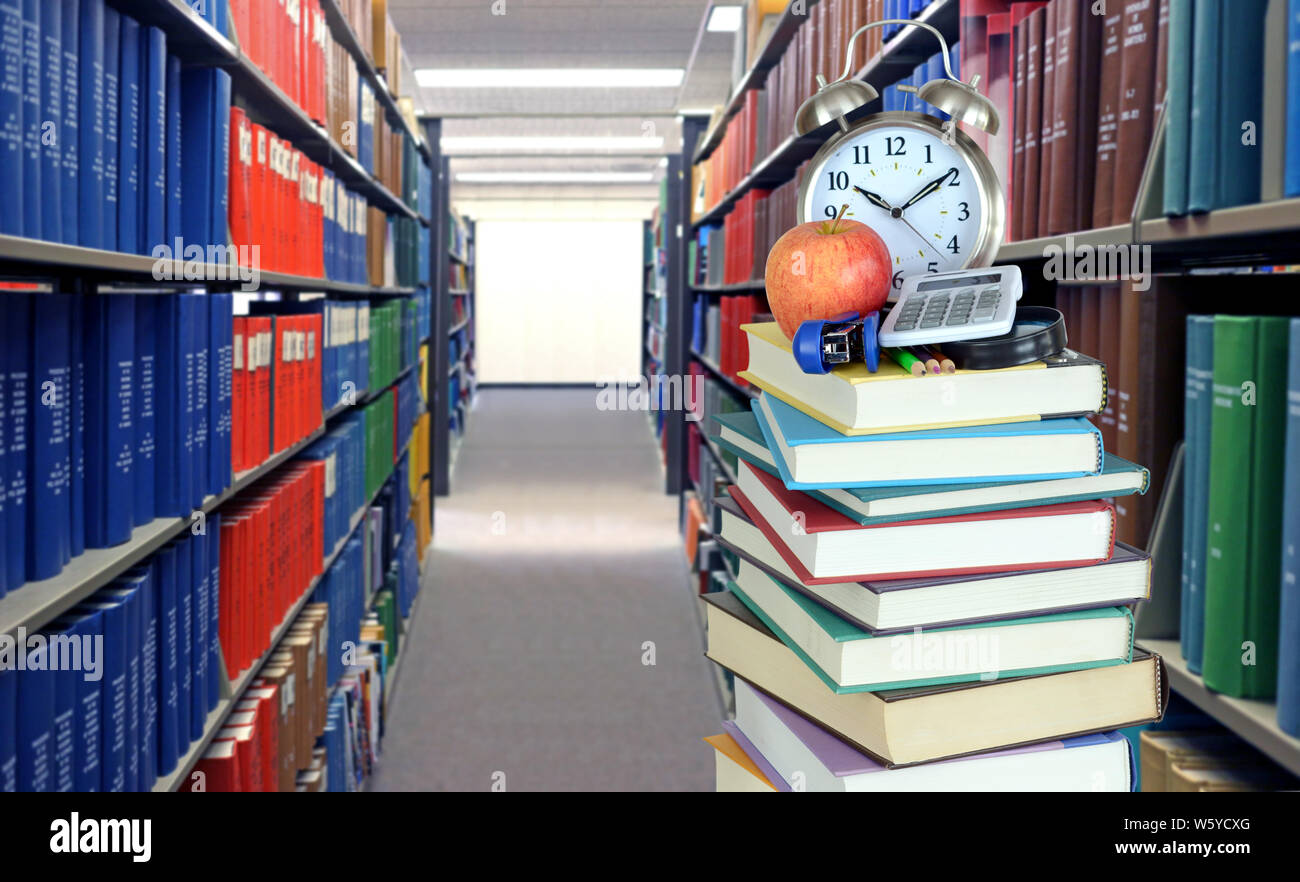 Education concept with stack of book in the library Stock Photo - Alamy