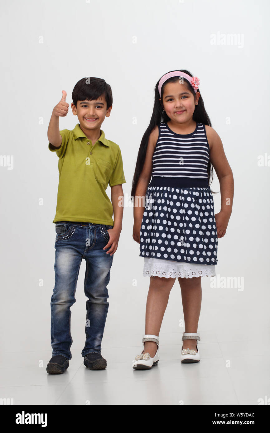 Two children standing together Stock Photo - Alamy