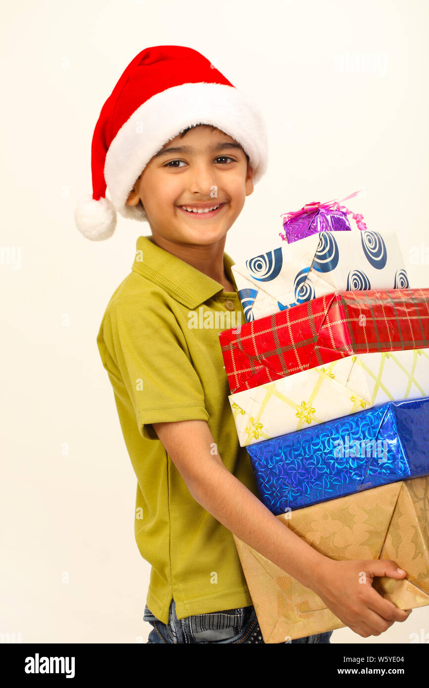 Boy carrying gifts hi-res stock photography and images - Alamy
