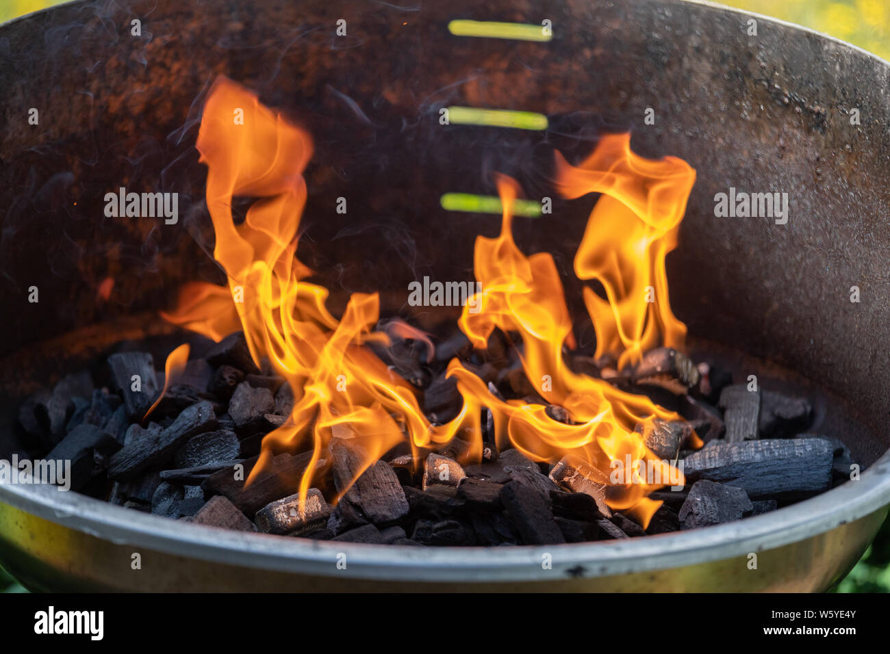 Barbecue grill with fire on nature, outdoor, close up Stock Photo - Alamy