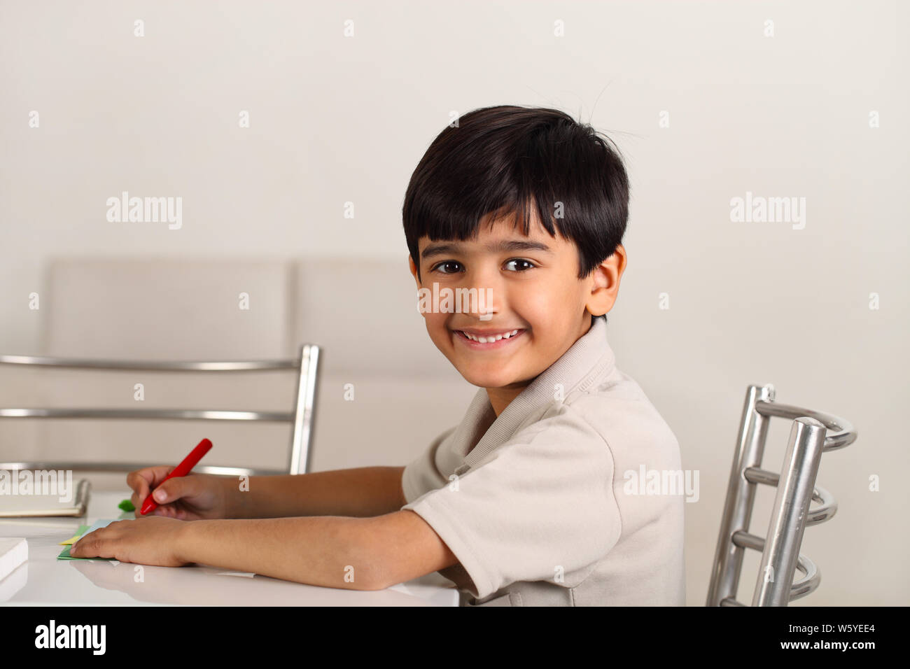 Boy drawing at home Stock Photo - Alamy