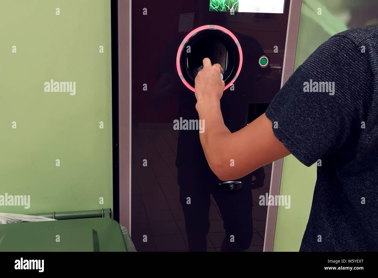 Shoppers return their bottles and cans of reusable packagings in a ...