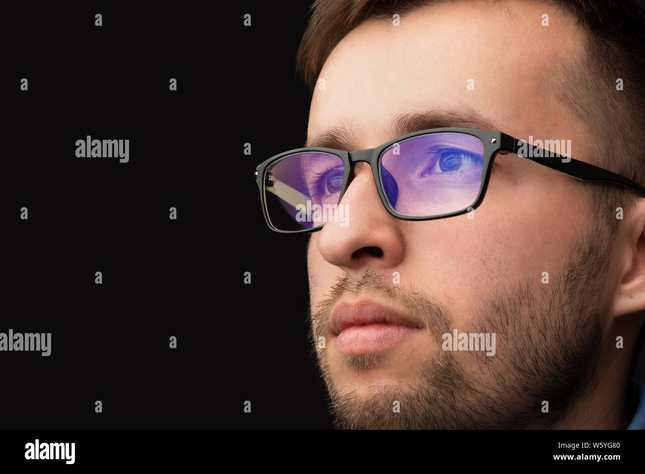 Young man looking with futuristic smart high tech glasses Stock Photo ...