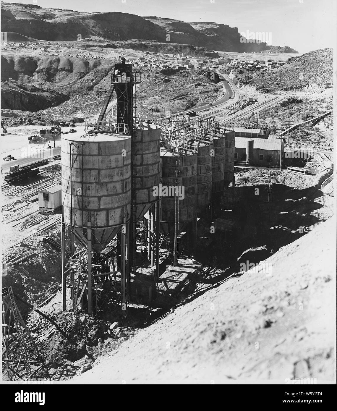 View of cement storage and blending plant - eight steel storage silos ...