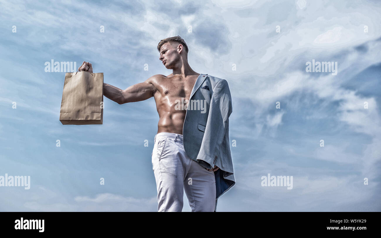 Guy attractive macho carry shopping bag made out of brown paper. Sales ...