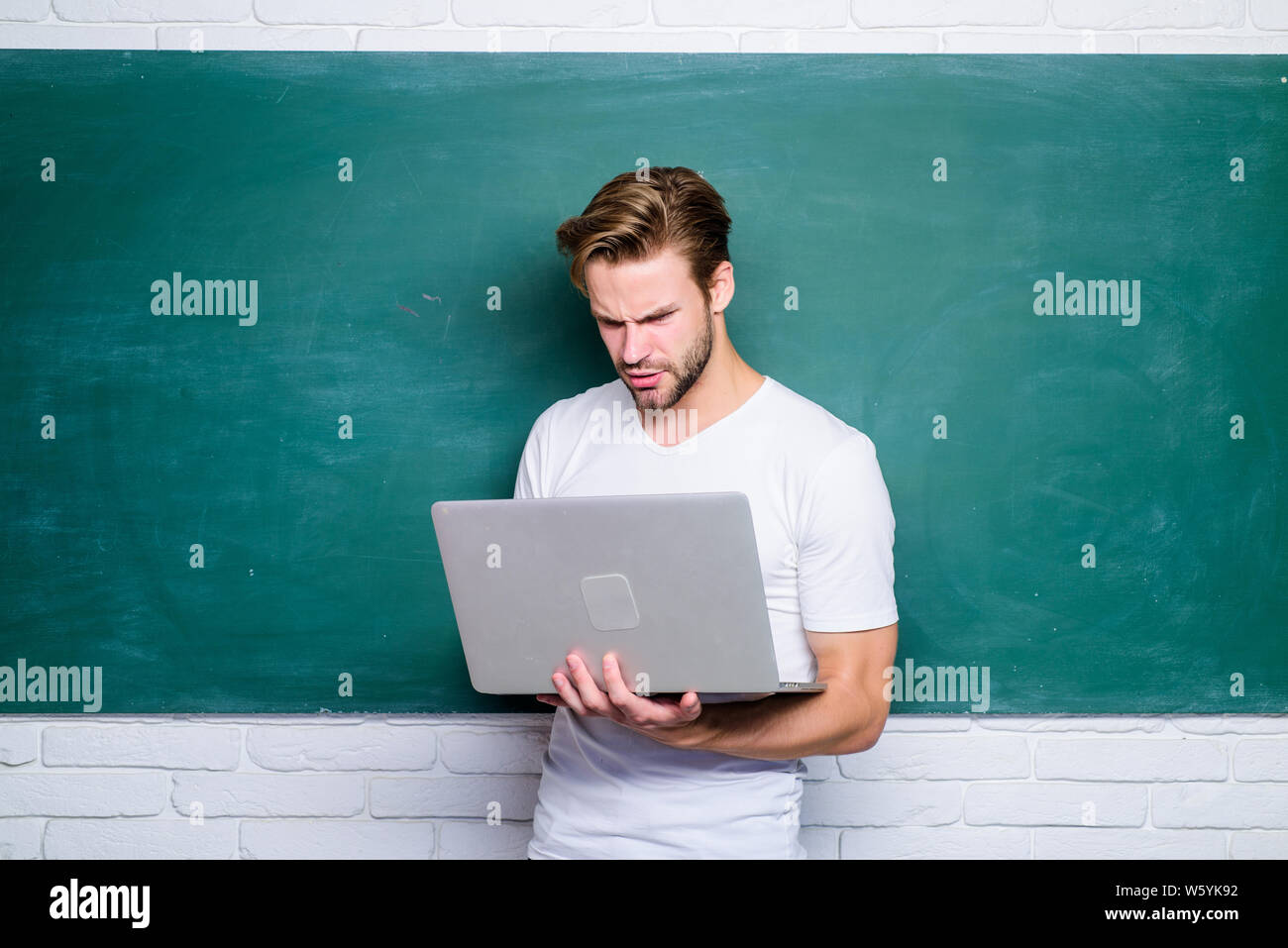 Student learn programming language. School teacher programming with ...