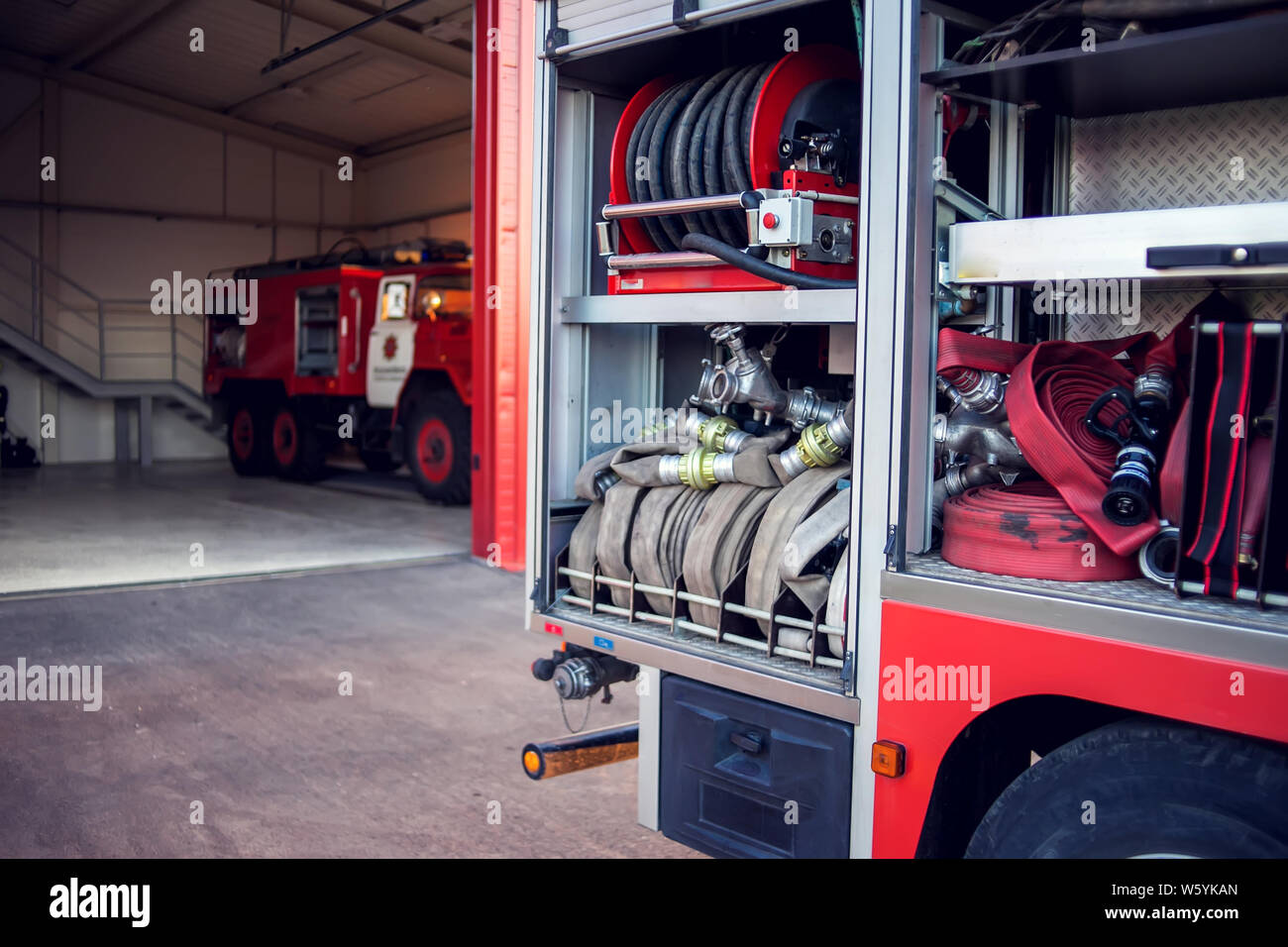 Fire truck engine with equipment in the fire department and ready for ...