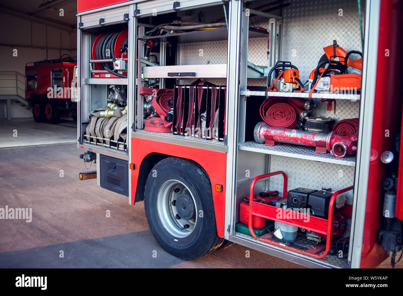 Fire truck engine with equipment in the fire department and ready for ...