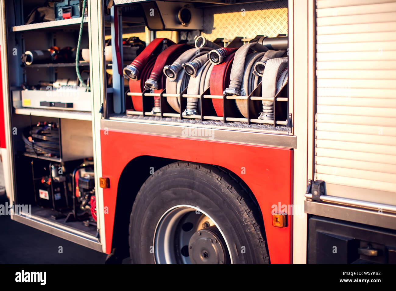 Fire truck engine with equipment in the fire department and ready for ...