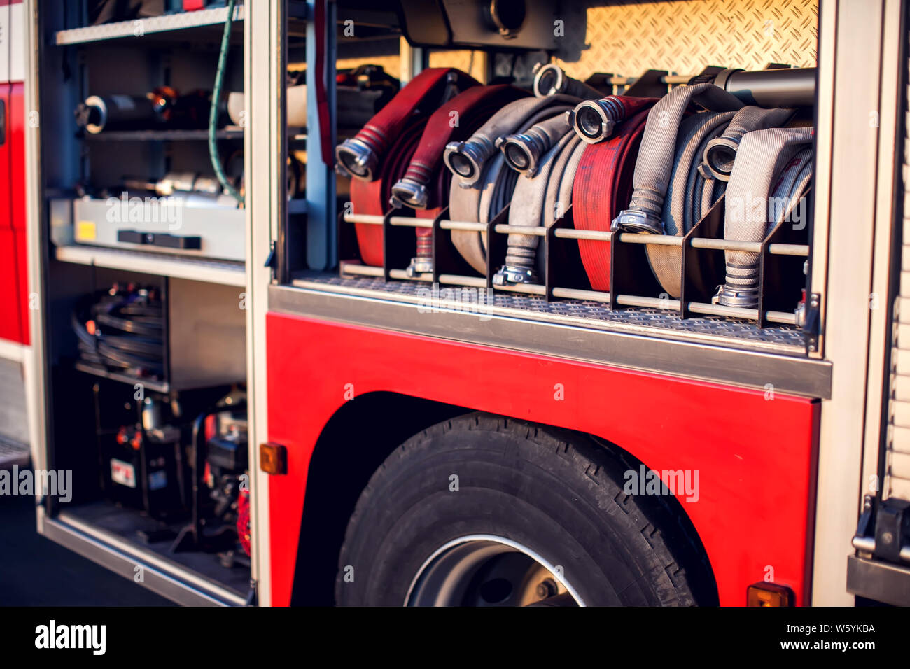 Fire truck engine with equipment in the fire department and ready for ...