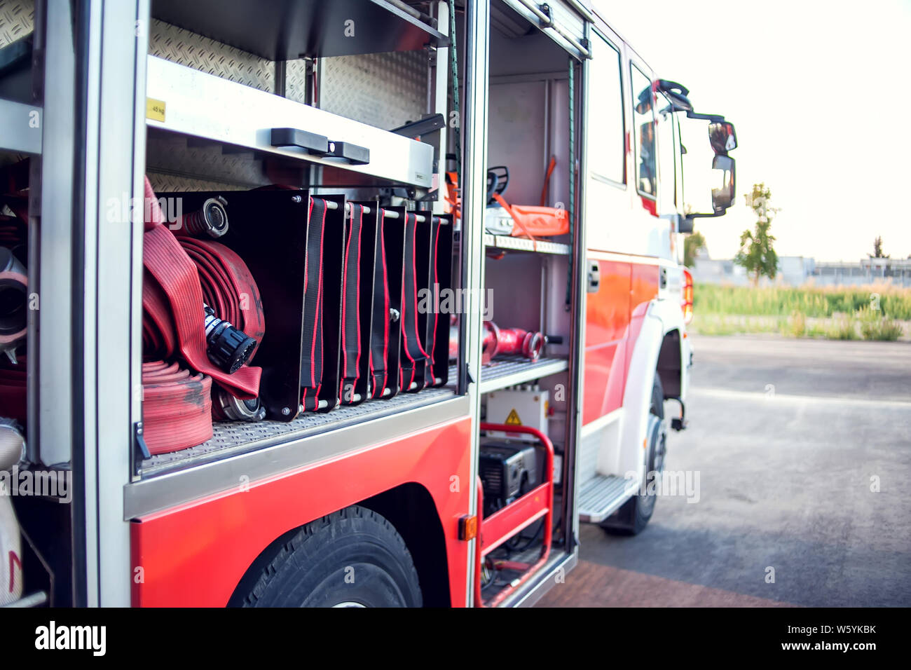 Fire truck engine with equipment in the fire department and ready for ...