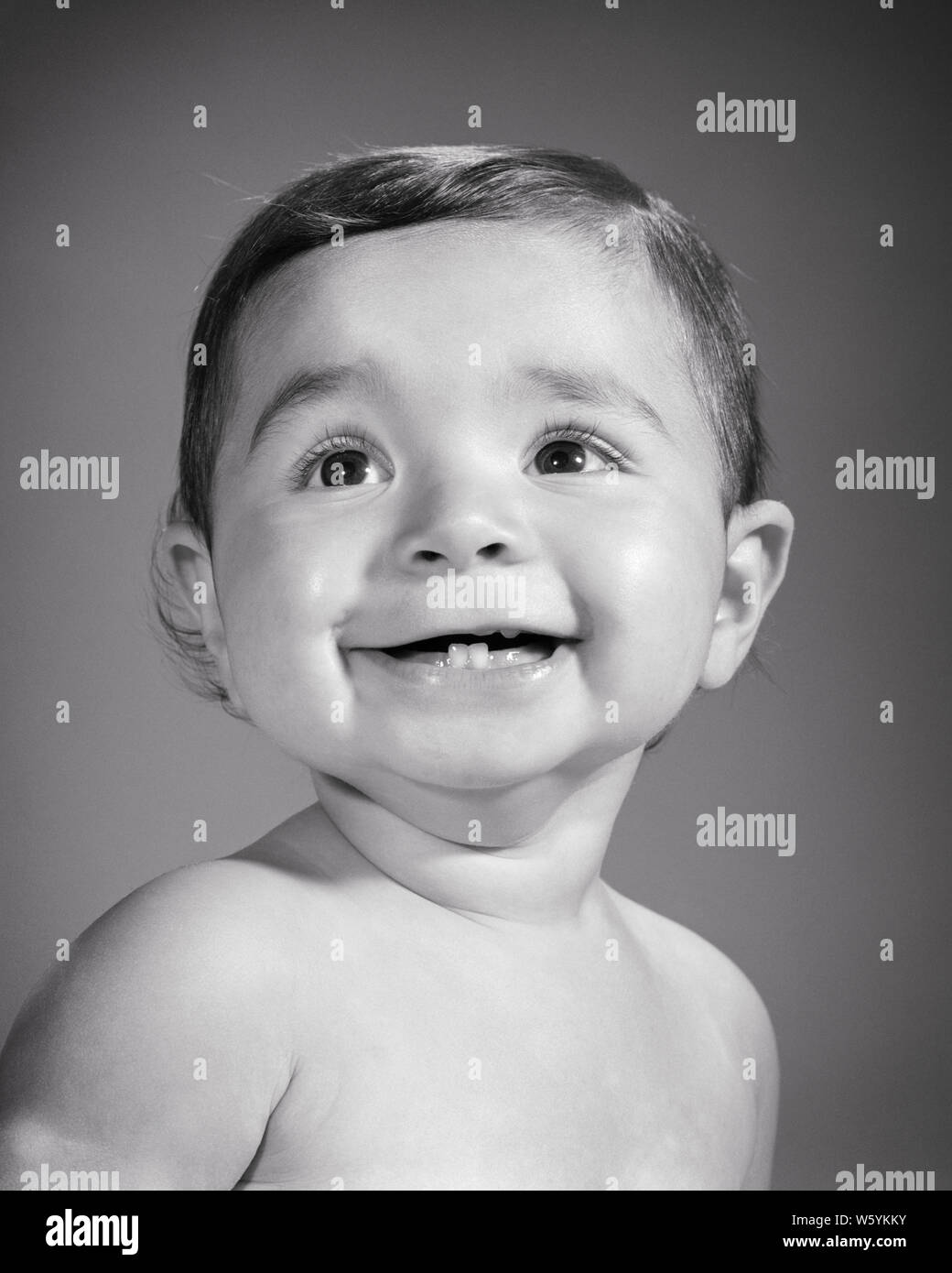 1960s PORTRAIT SMILING WIDE-EYED BRUNETTE BABY GIRL LOOKING UP - b23432 ...