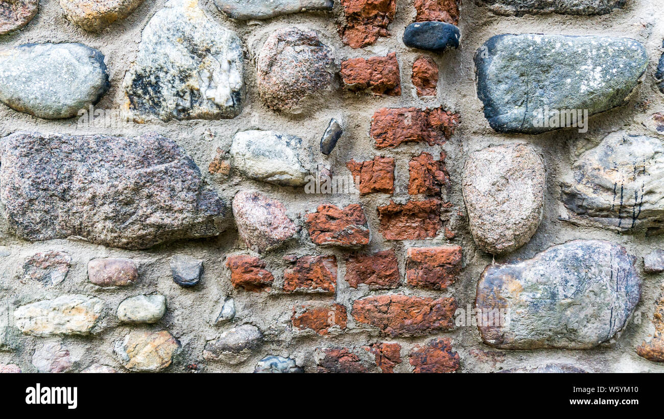 wall of field stones and red bricks Stock Photo - Alamy