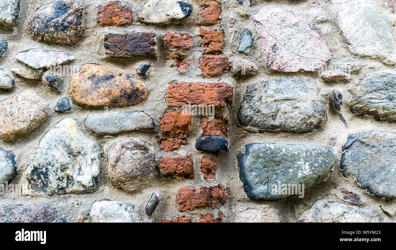 wall of field stones and red bricks Stock Photo - Alamy