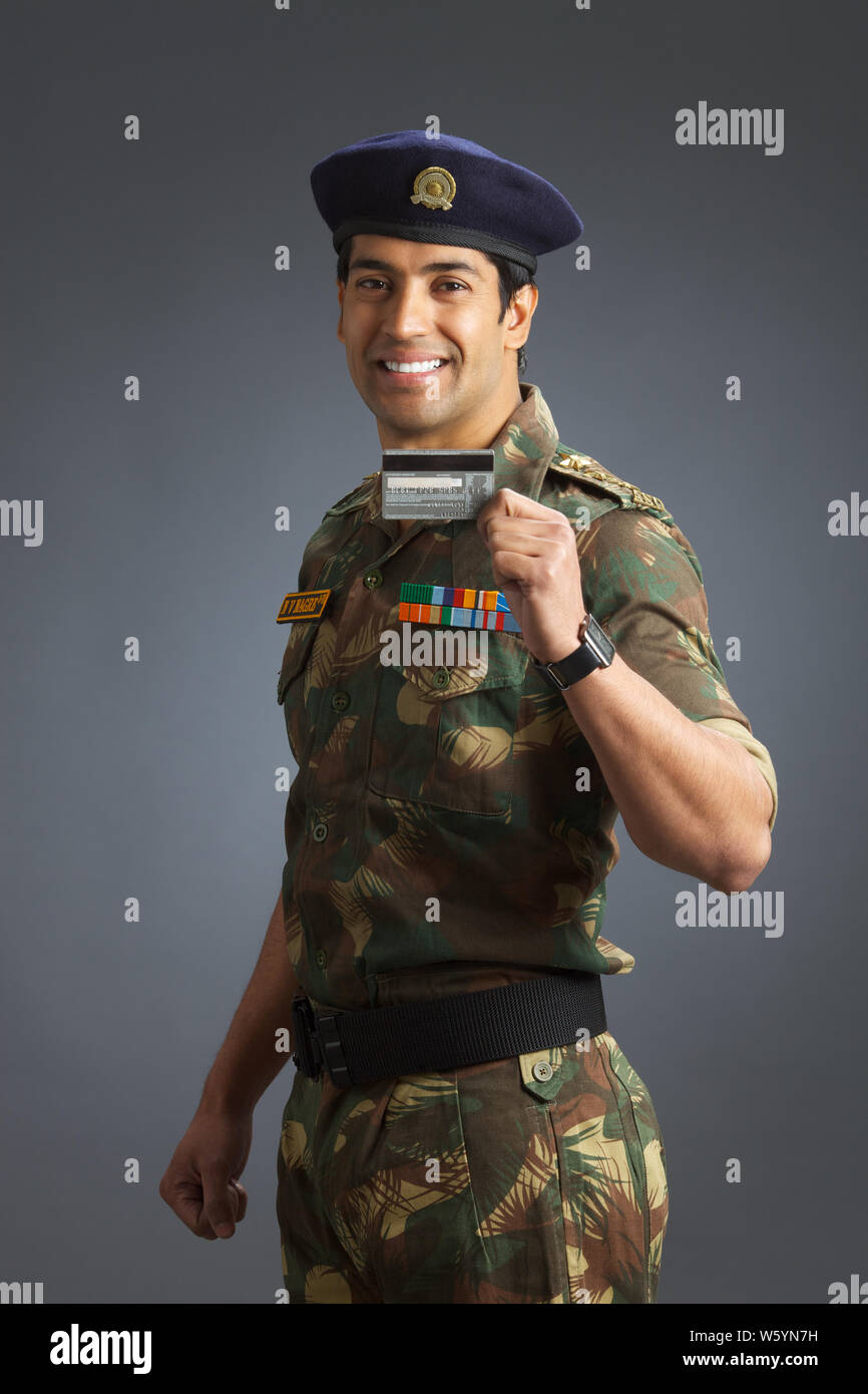 Army soldier showing a credit card Stock Photo - Alamy