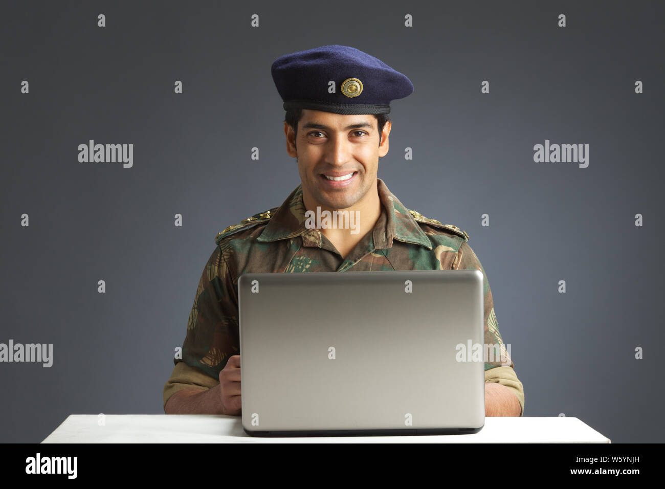 Army Soldier working on a laptop Stock Photo - Alamy