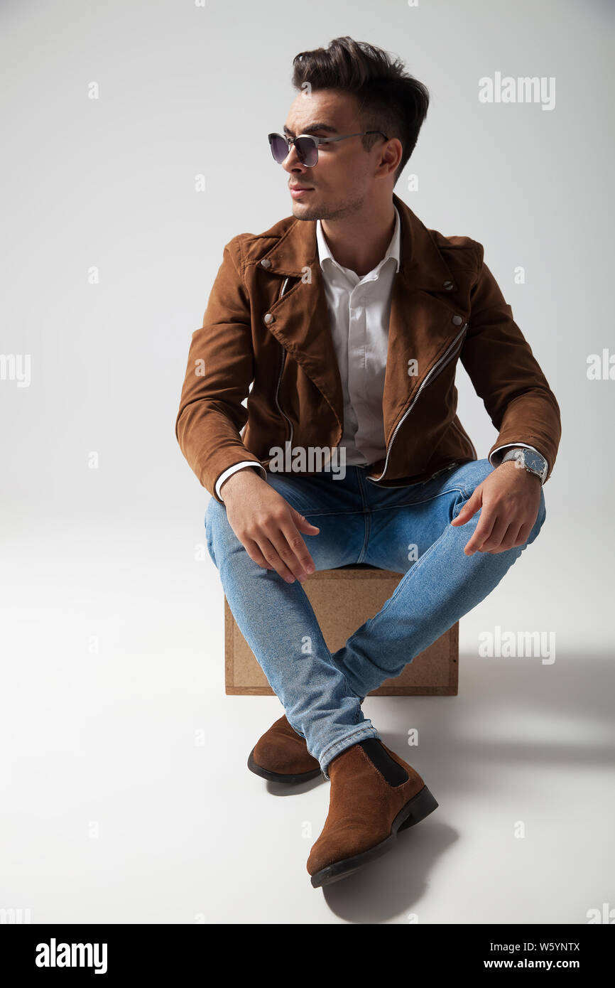 Male model sitting on box hi-res stock photography and images - Alamy