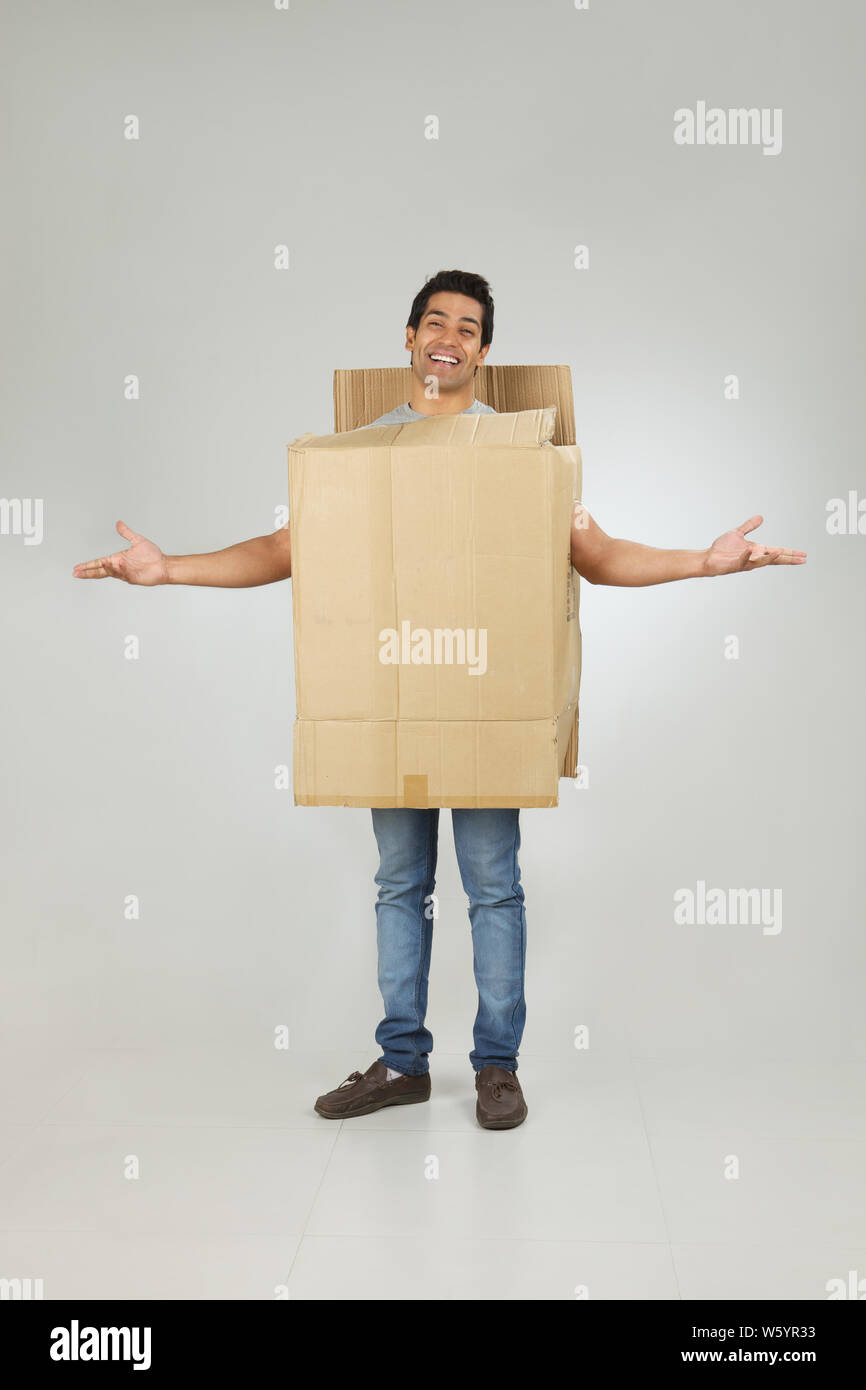 Man wearing cardboard box having fun Stock Photo - Alamy