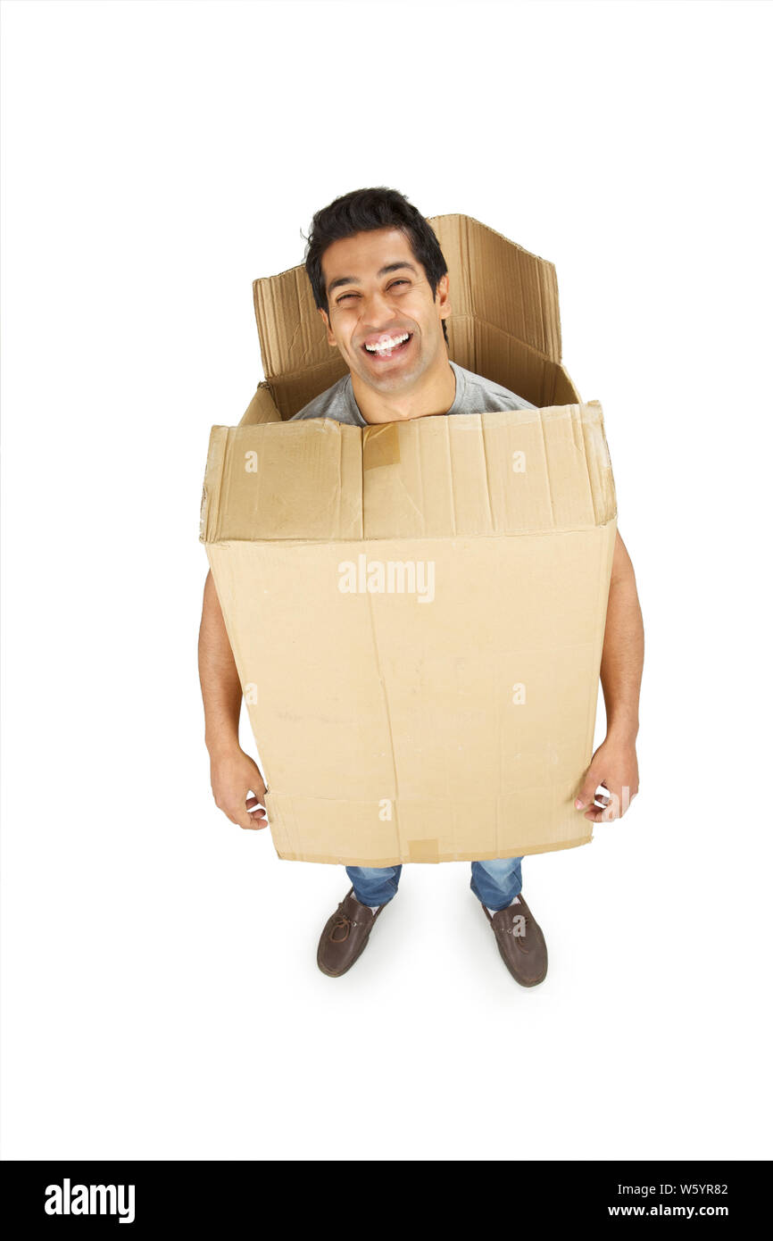 Man wearing cardboard box smiling Stock Photo - Alamy
