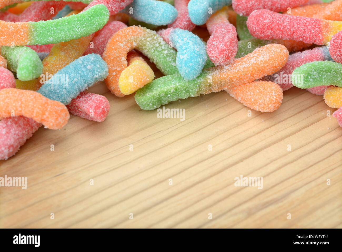 colorful neon gummy candies for background use Stock Photo - Alamy