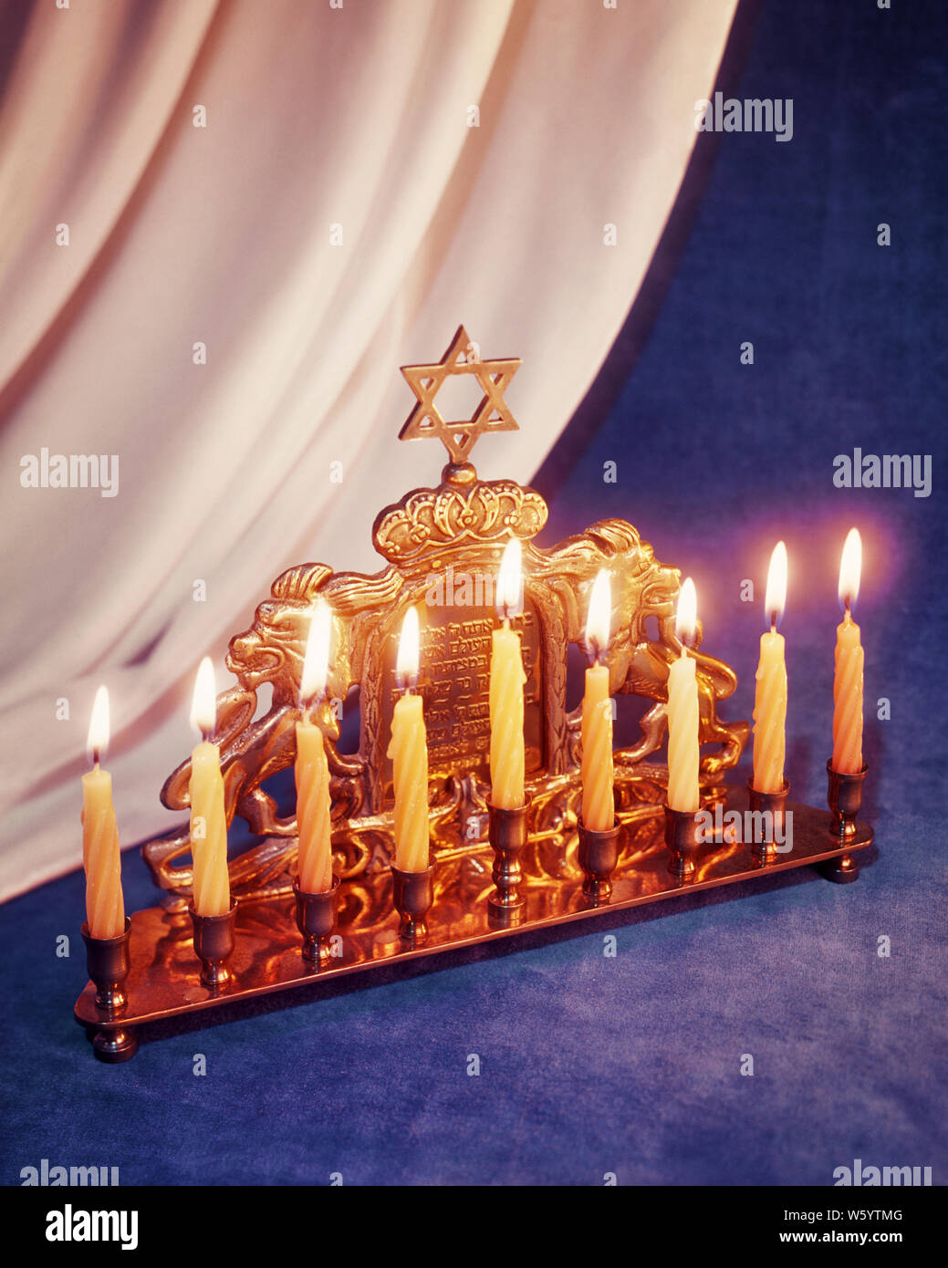 BRASS HANUKKAH CANDELABRUM MENORAH NINE BURNING CANDLES INDICATING THE ...