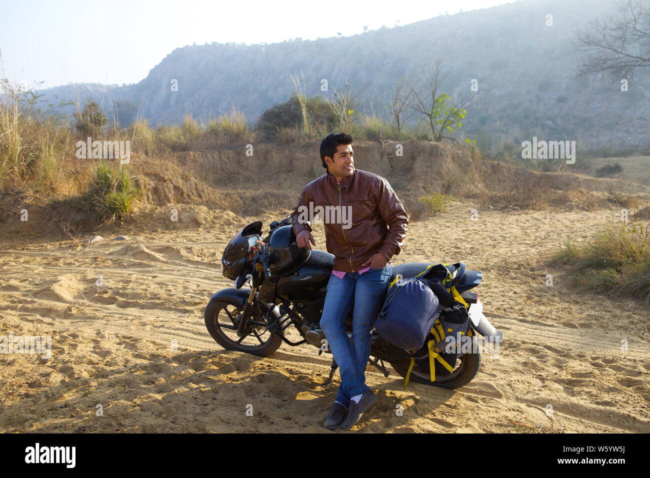 Man leaning against motorcycle hi-res stock photography and images - Alamy