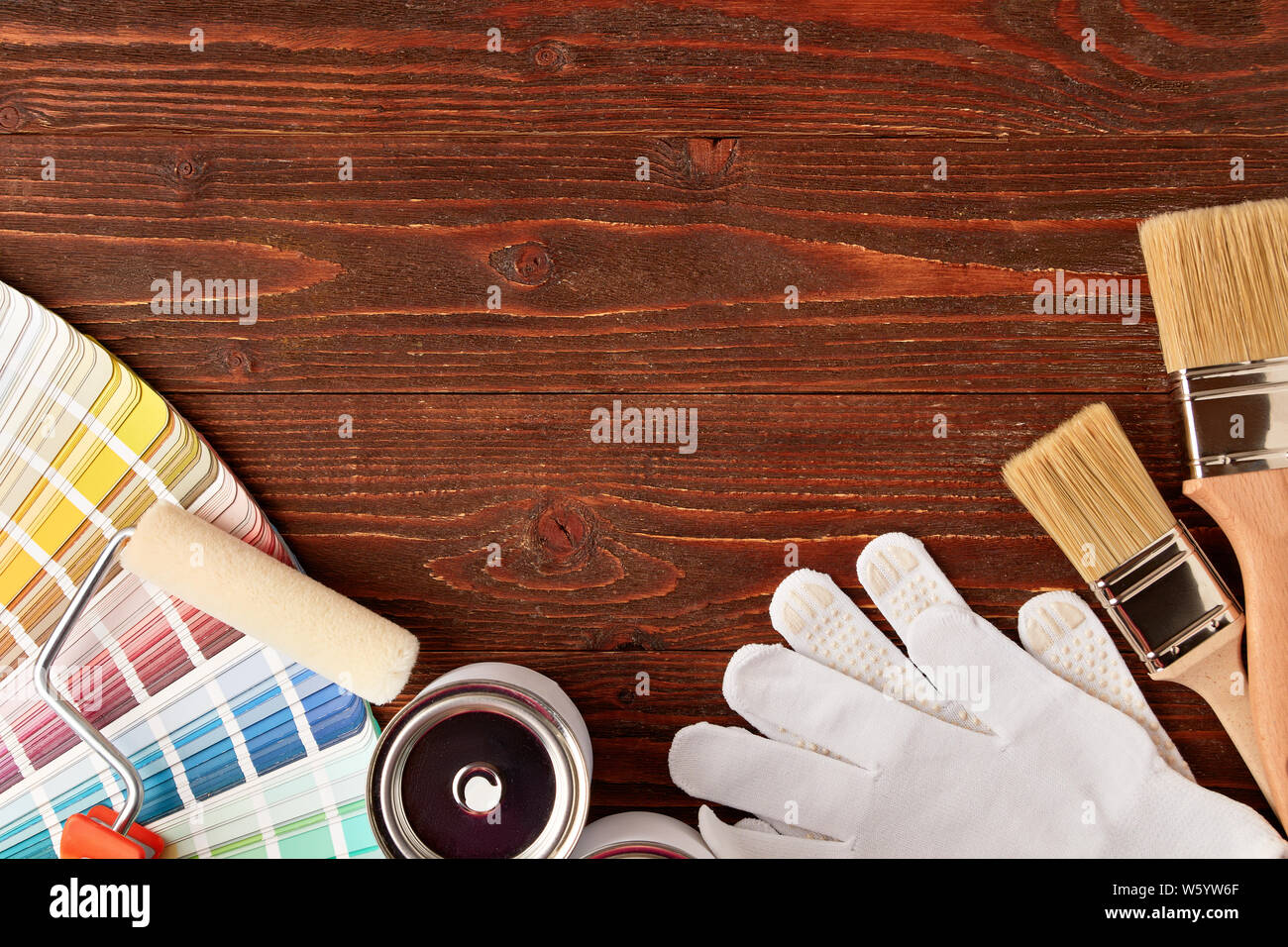 Diverse painting tools, brushes, can with paint, color guide palette on ...