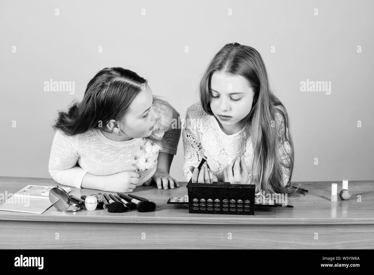 Experts in colour. Adorable small makeup artists using colour cosmetics ...