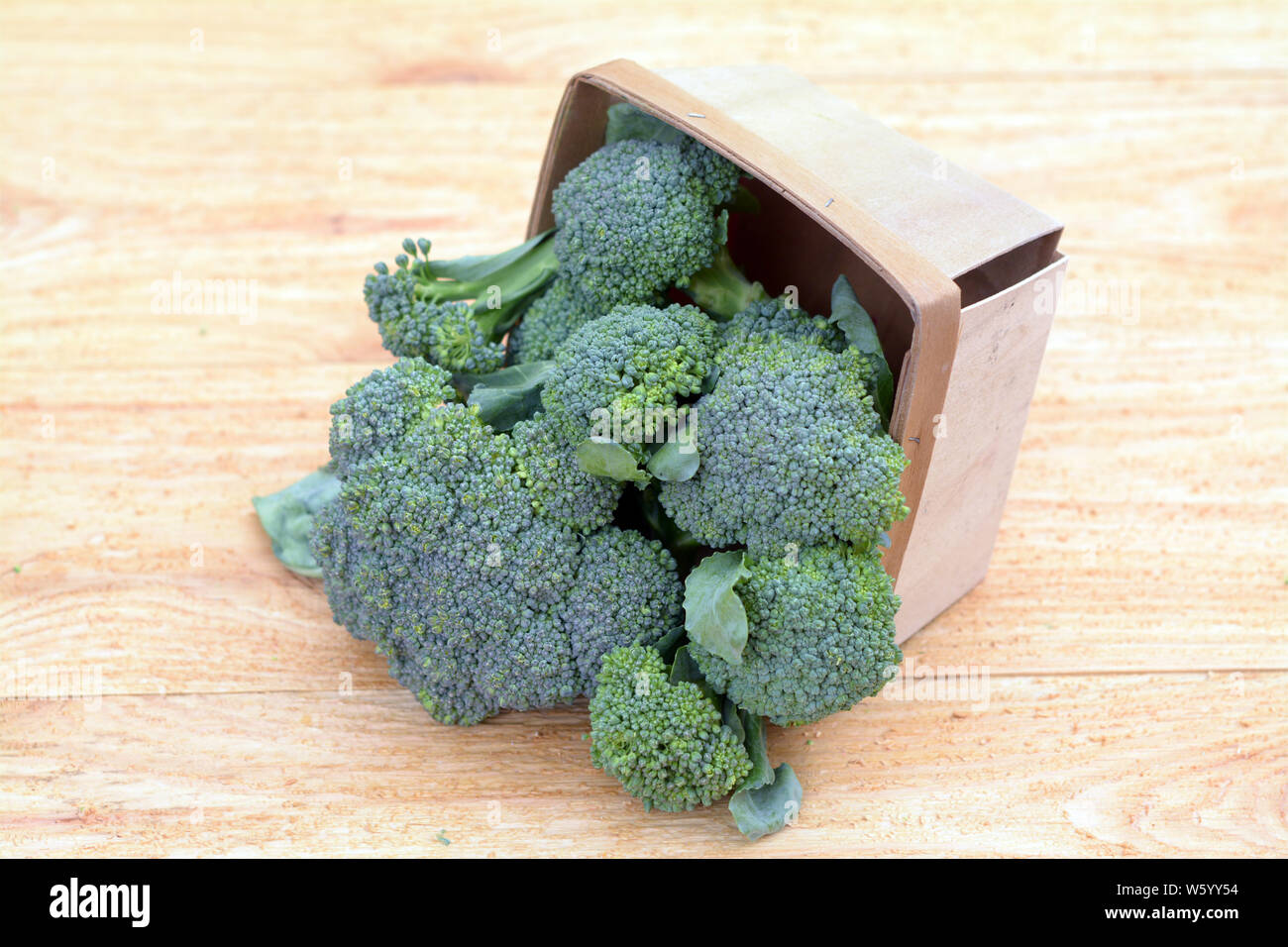 fresh broccoli in crate isolated on table Stock Photo - Alamy