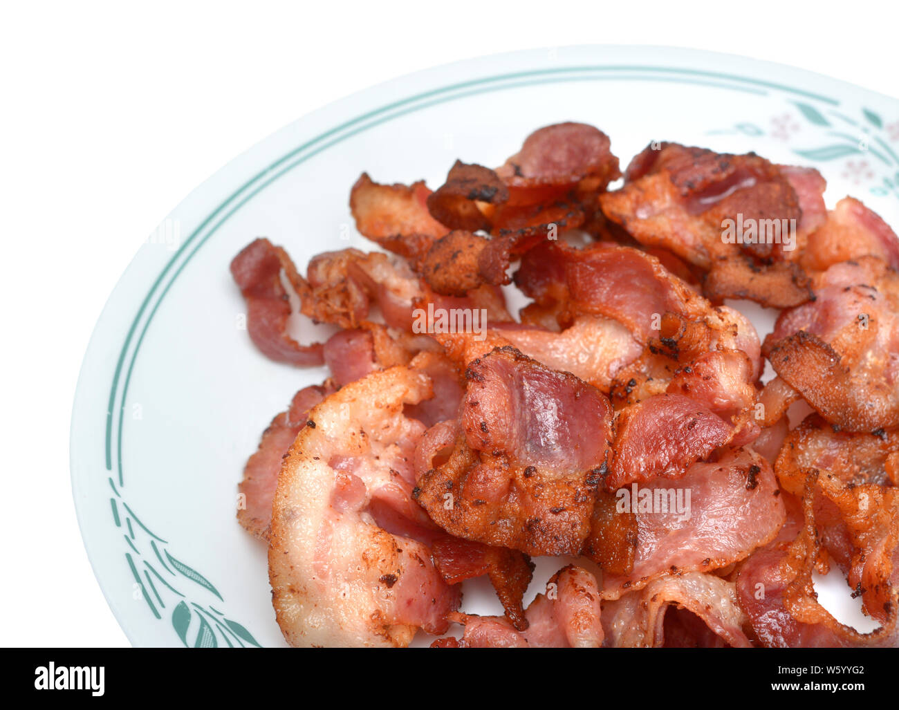 fried Bacon strips on dish isolated on white background Stock Photo - Alamy