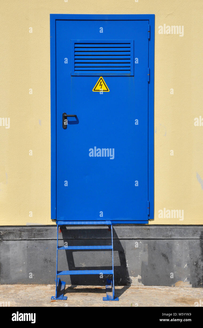 Iron blue gray door of a transformer box. Electricity, high voltage, do ...