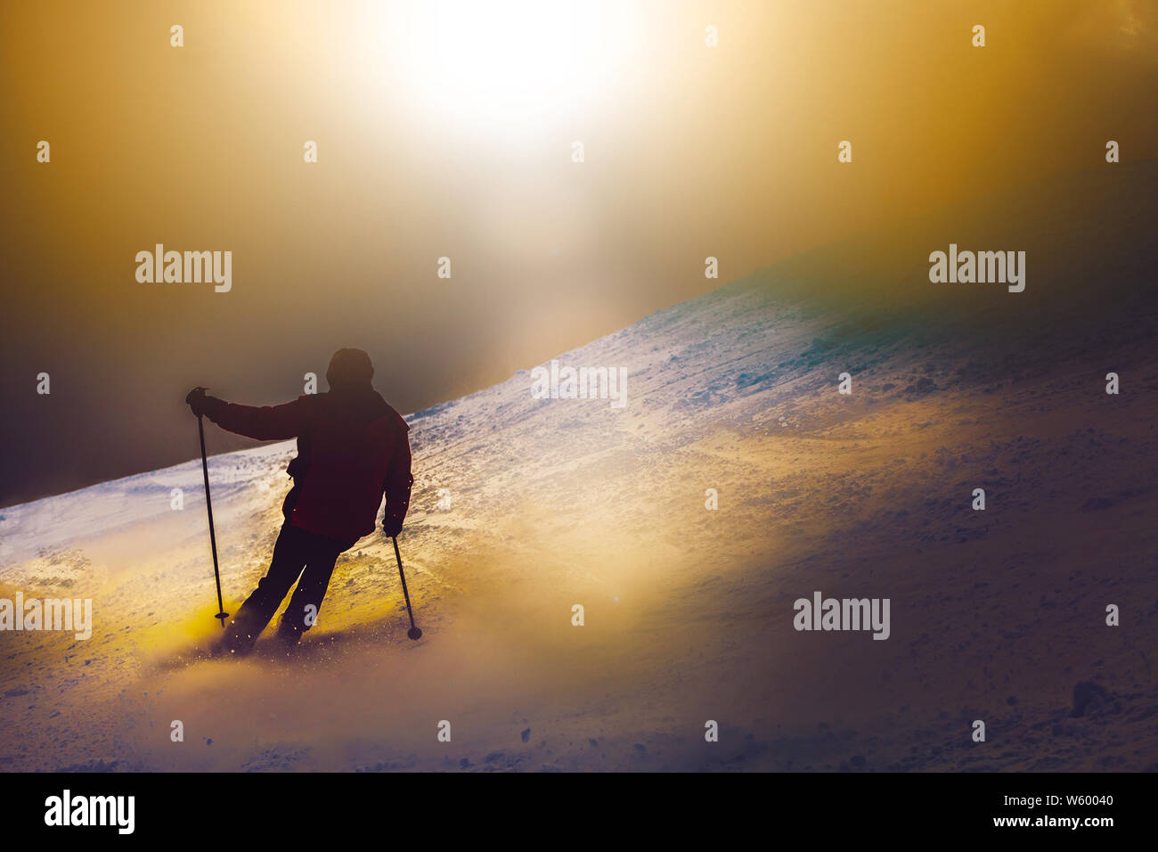Skier silhouette sunset ride in the mountains Stock Photo - Alamy