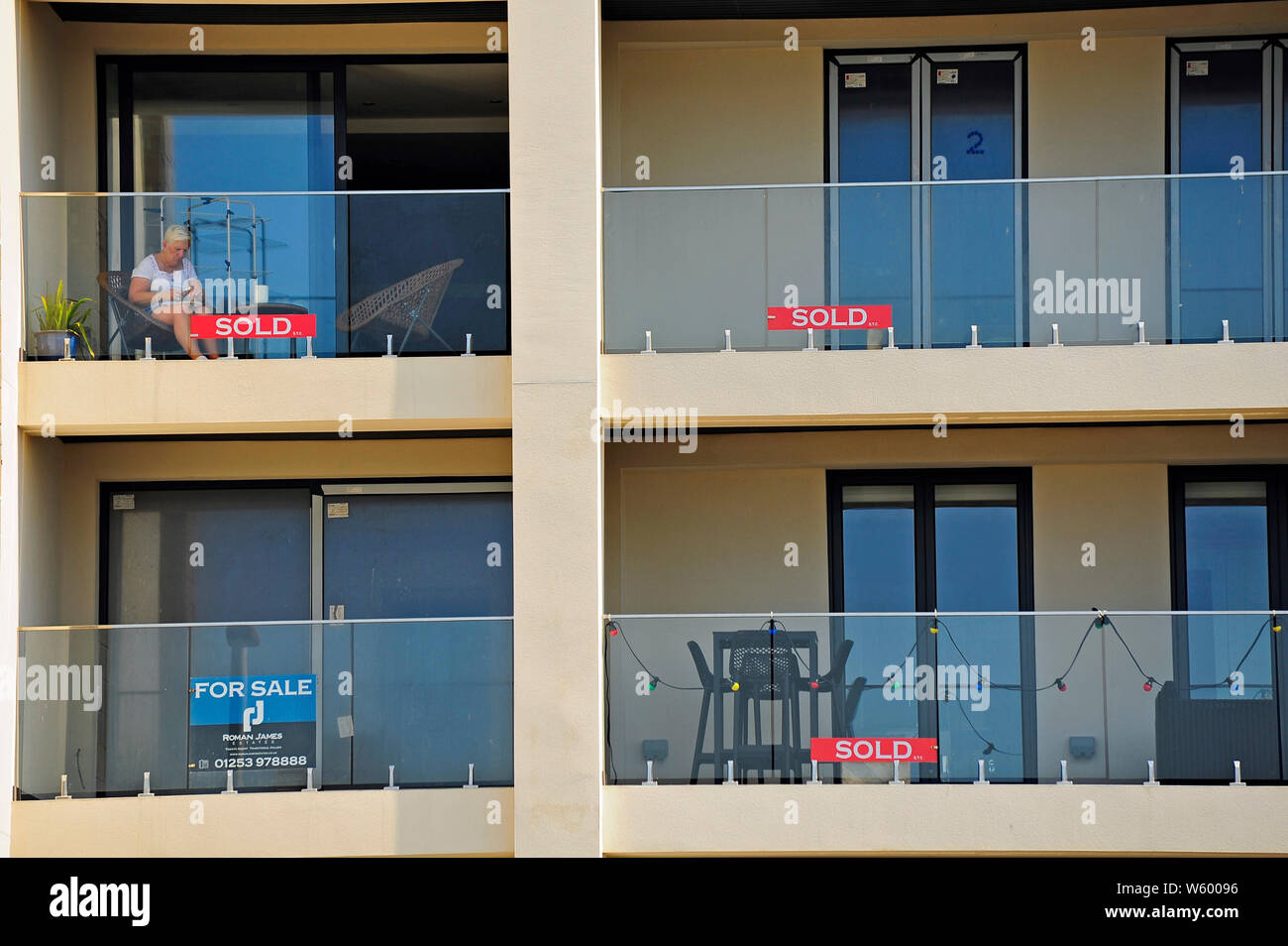 New apartment block with apartments showing both sold and for sale ...