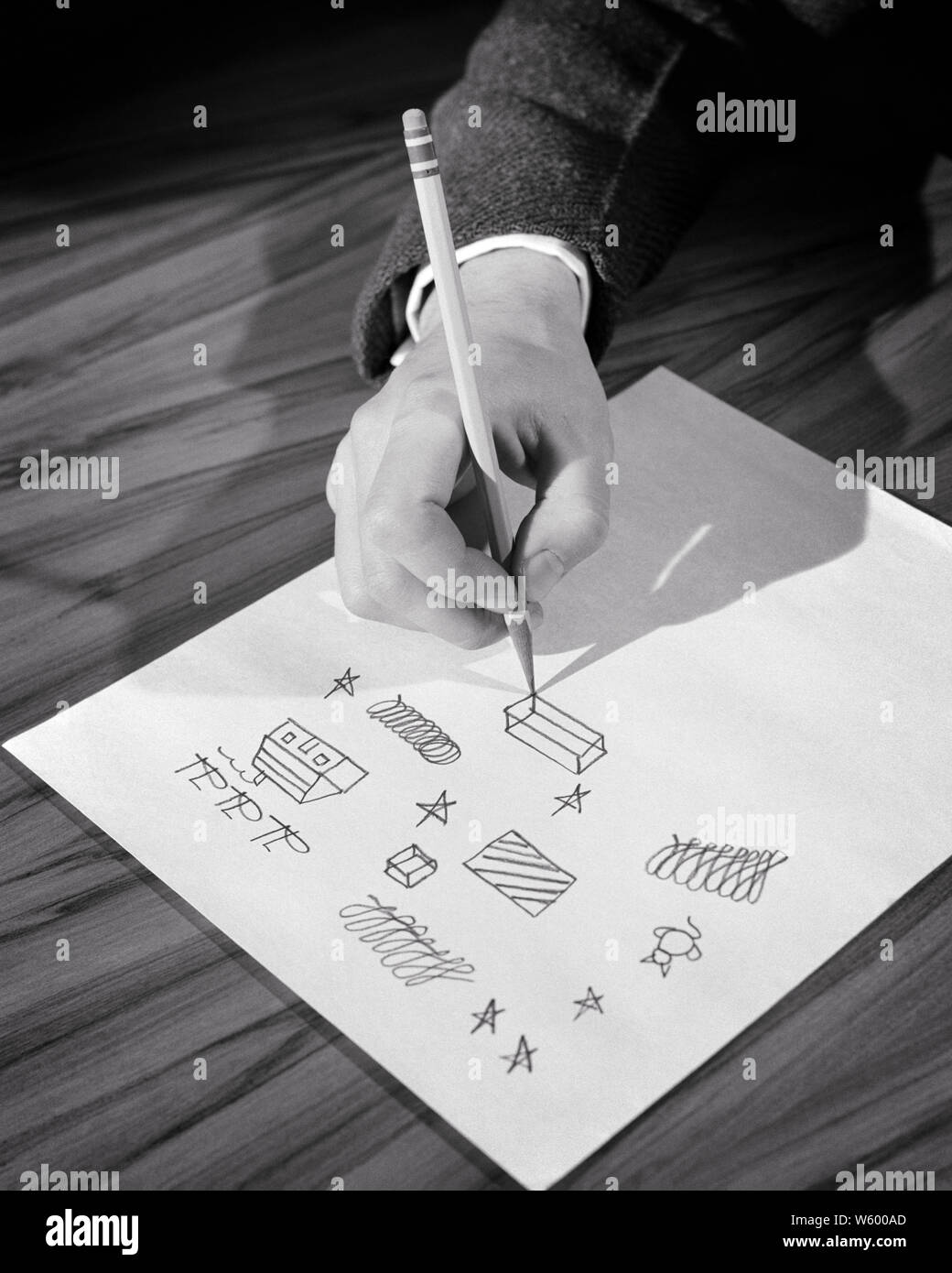 1940s MALE HAND HOLDING PENCIL DRAWING DOODLING SHAPES CUBES RECTANGLES ...