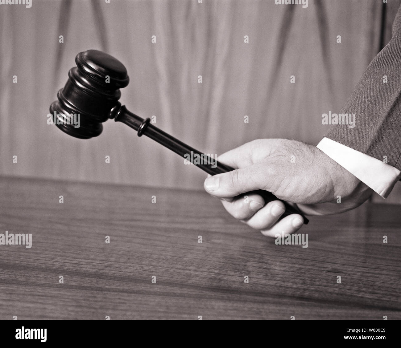 1930s hand holding a gavel poised to strike come to order - s4555 ...