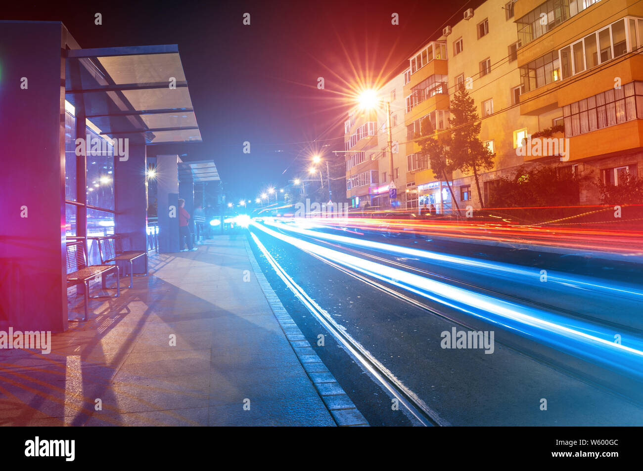 Trail lights of traffic going through a small town area Stock Photo - Alamy